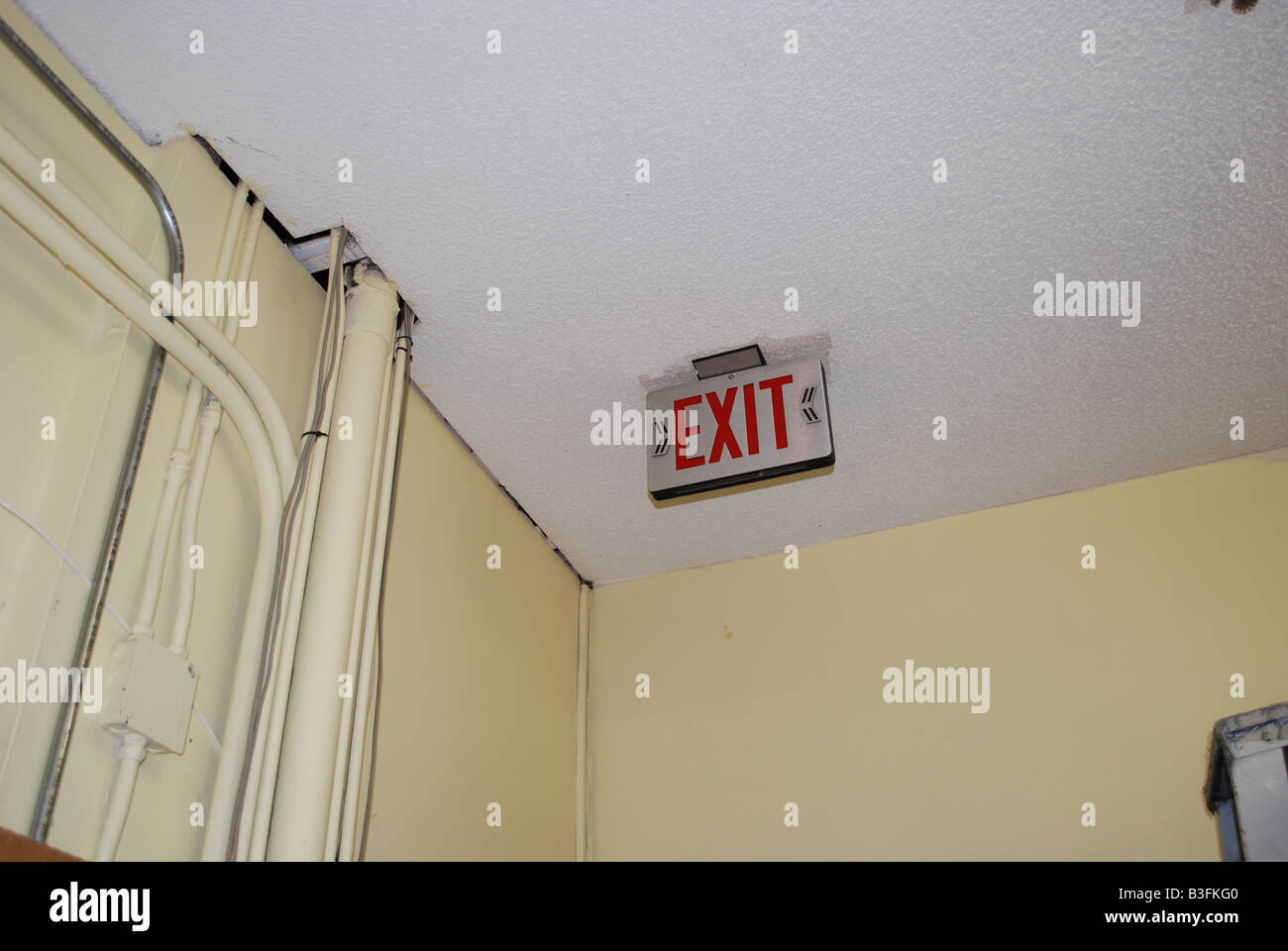conduit and exit sign Stock Photo - Alamy