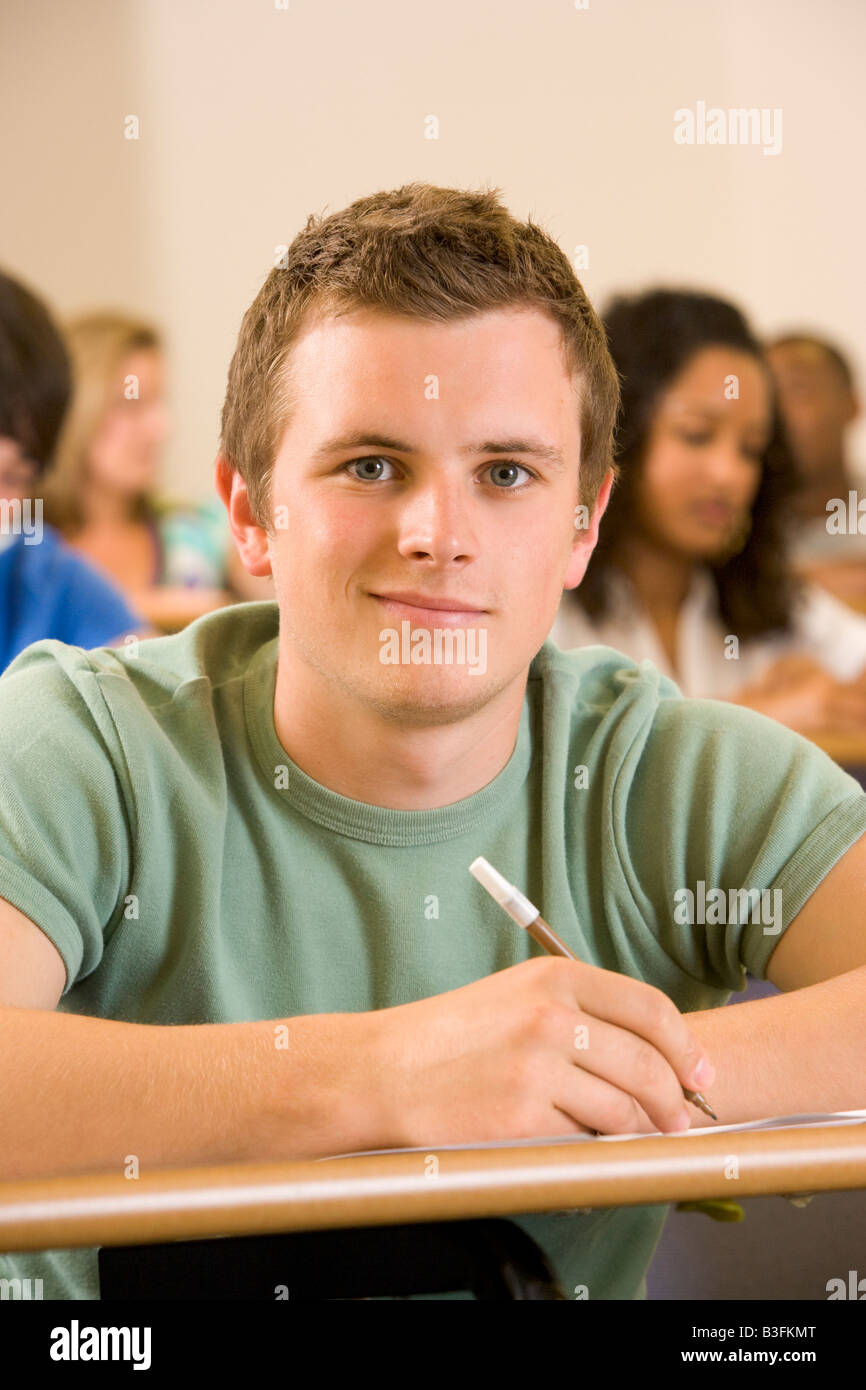 Student in class taking notes (selective focus Stock Photo - Alamy