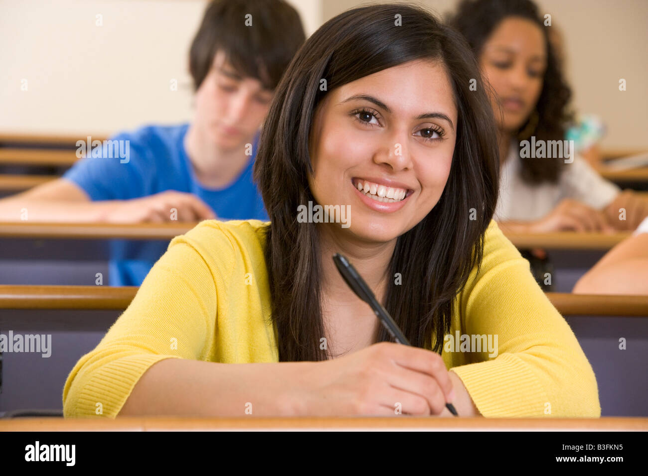 Student in class taking notes (selective focus Stock Photo - Alamy