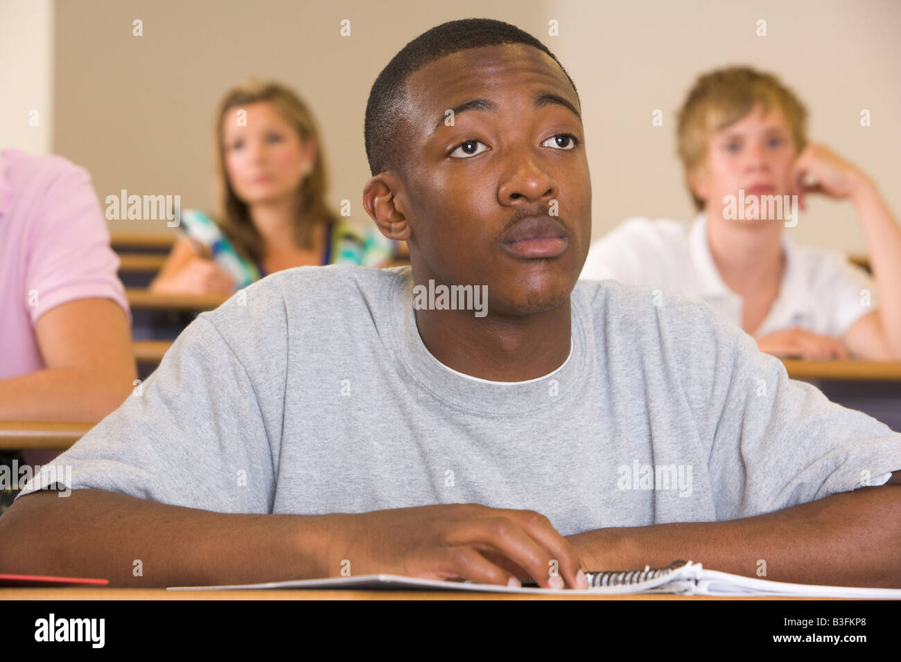 Student in class taking notes (selective focus Stock Photo - Alamy