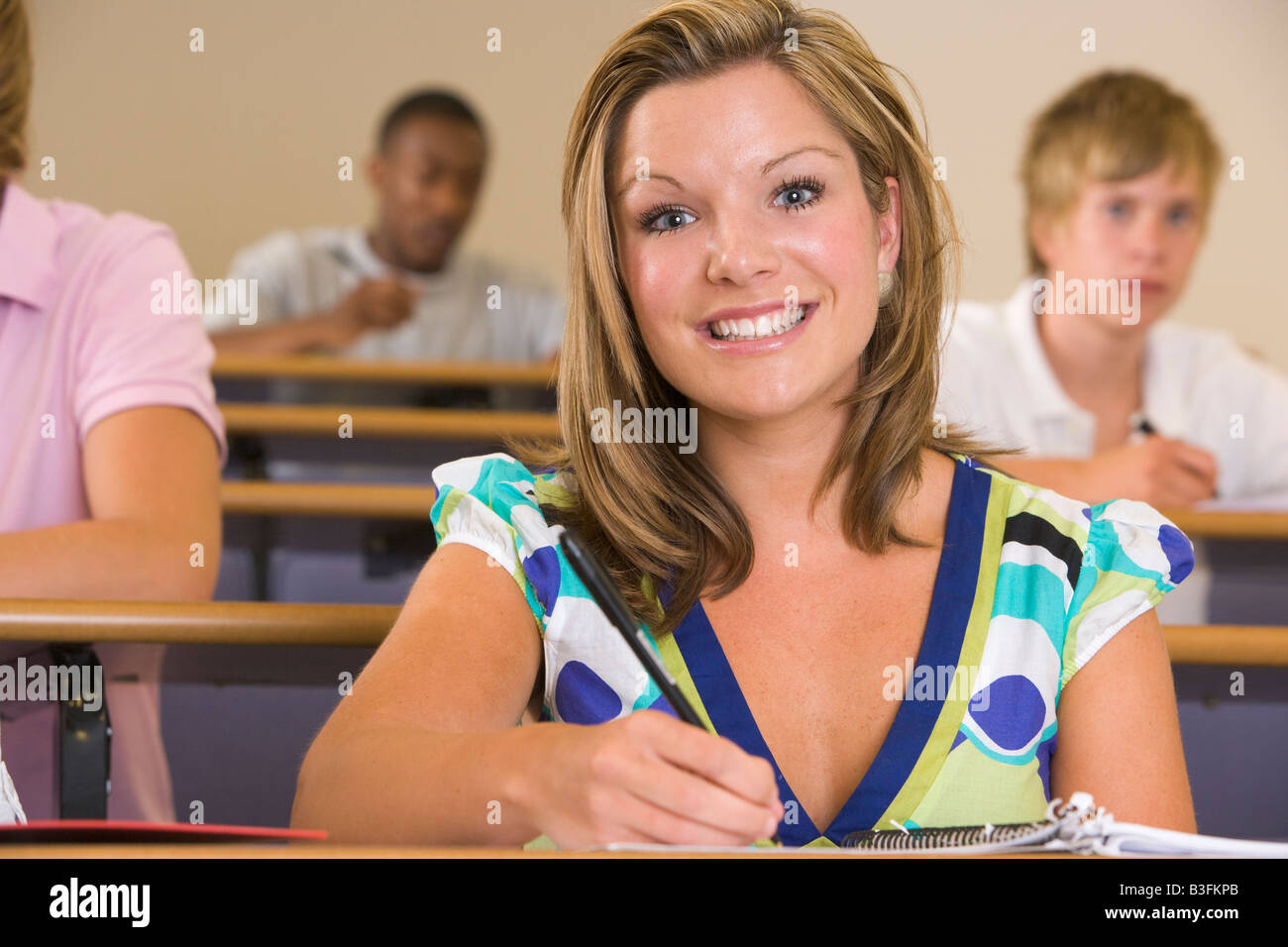 Student in class taking notes (selective focus Stock Photo - Alamy