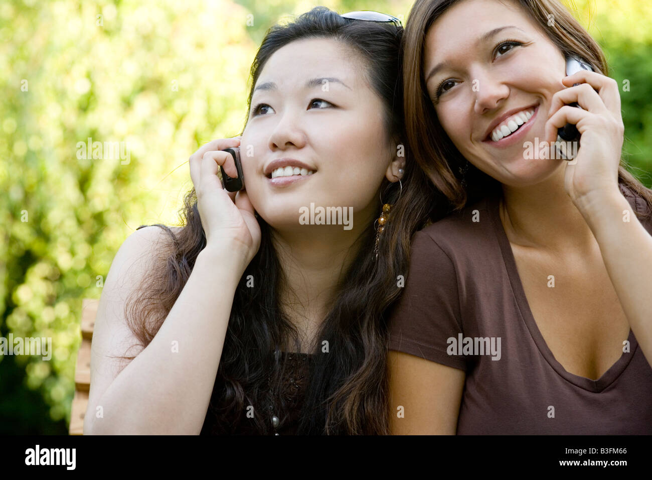 girls calling in the park Stock Photo - Alamy