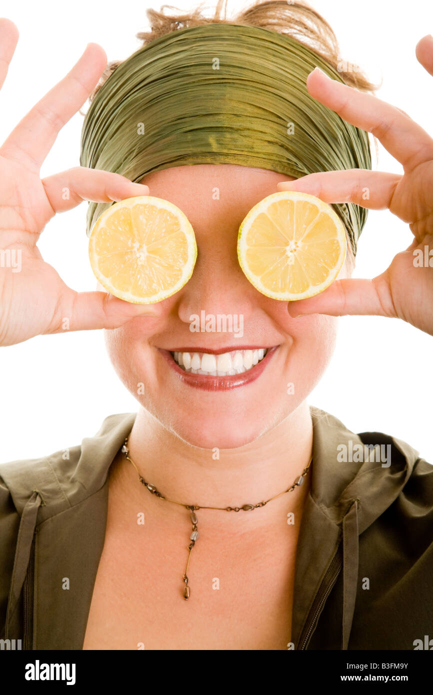 laughing woman with lemon at the eyes Stock Photo - Alamy