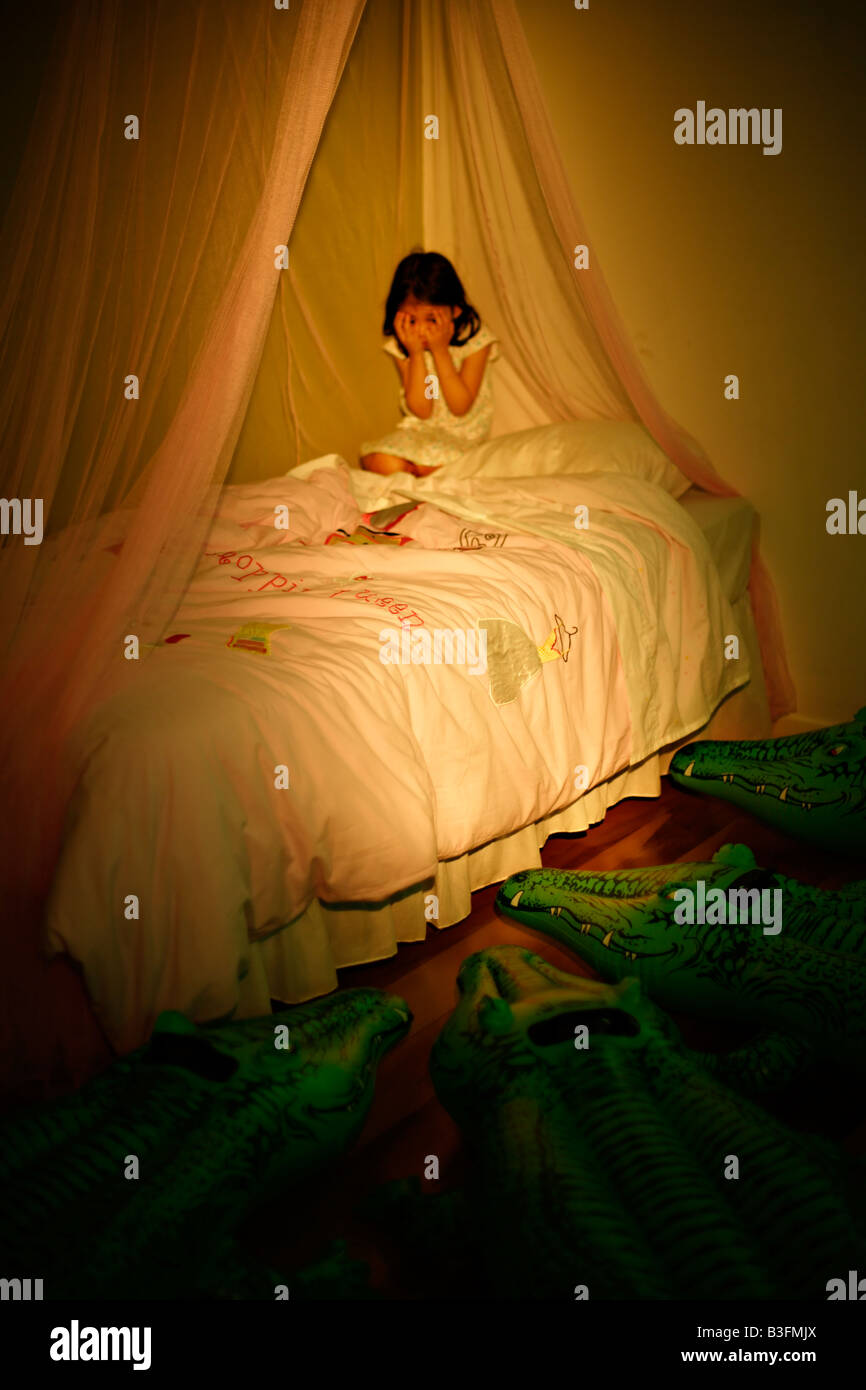 Inflatable crocodile series. Lurking by a child's bed Stock Photo - Alamy
