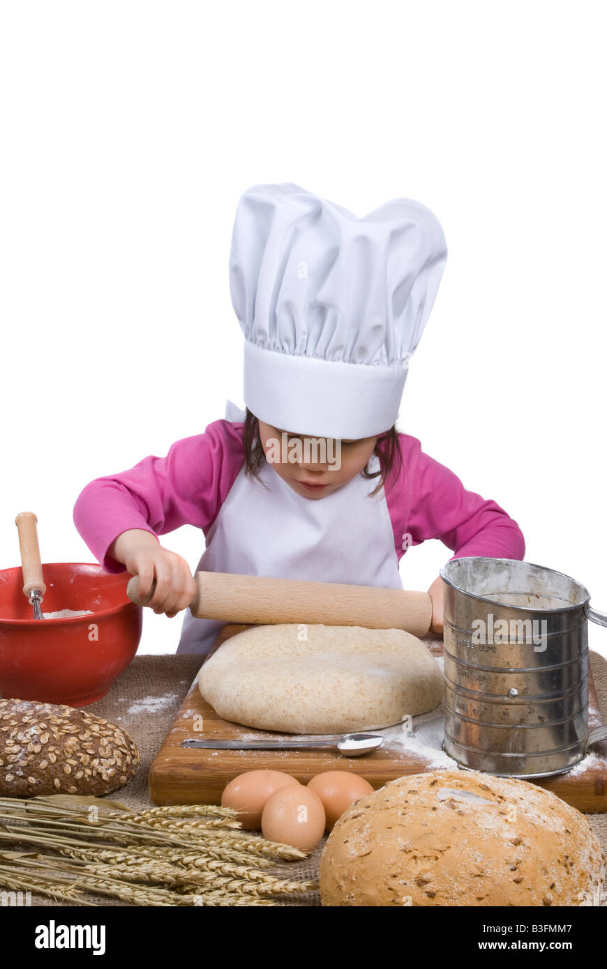 A young girl having fun in the kitchen making a mess Stock Photo - Alamy