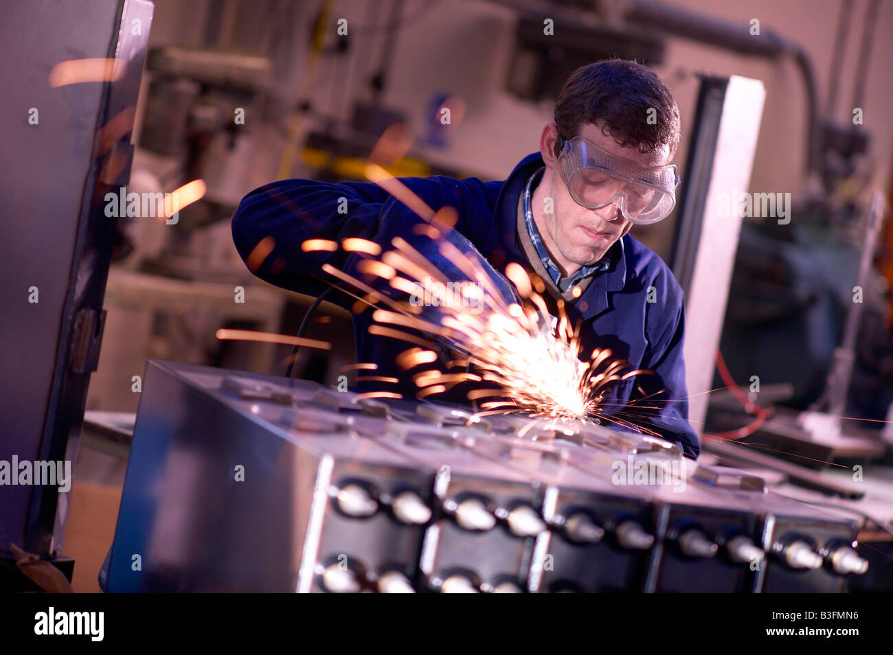 FACTORY WORKER GRINDING Stock Photo - Alamy