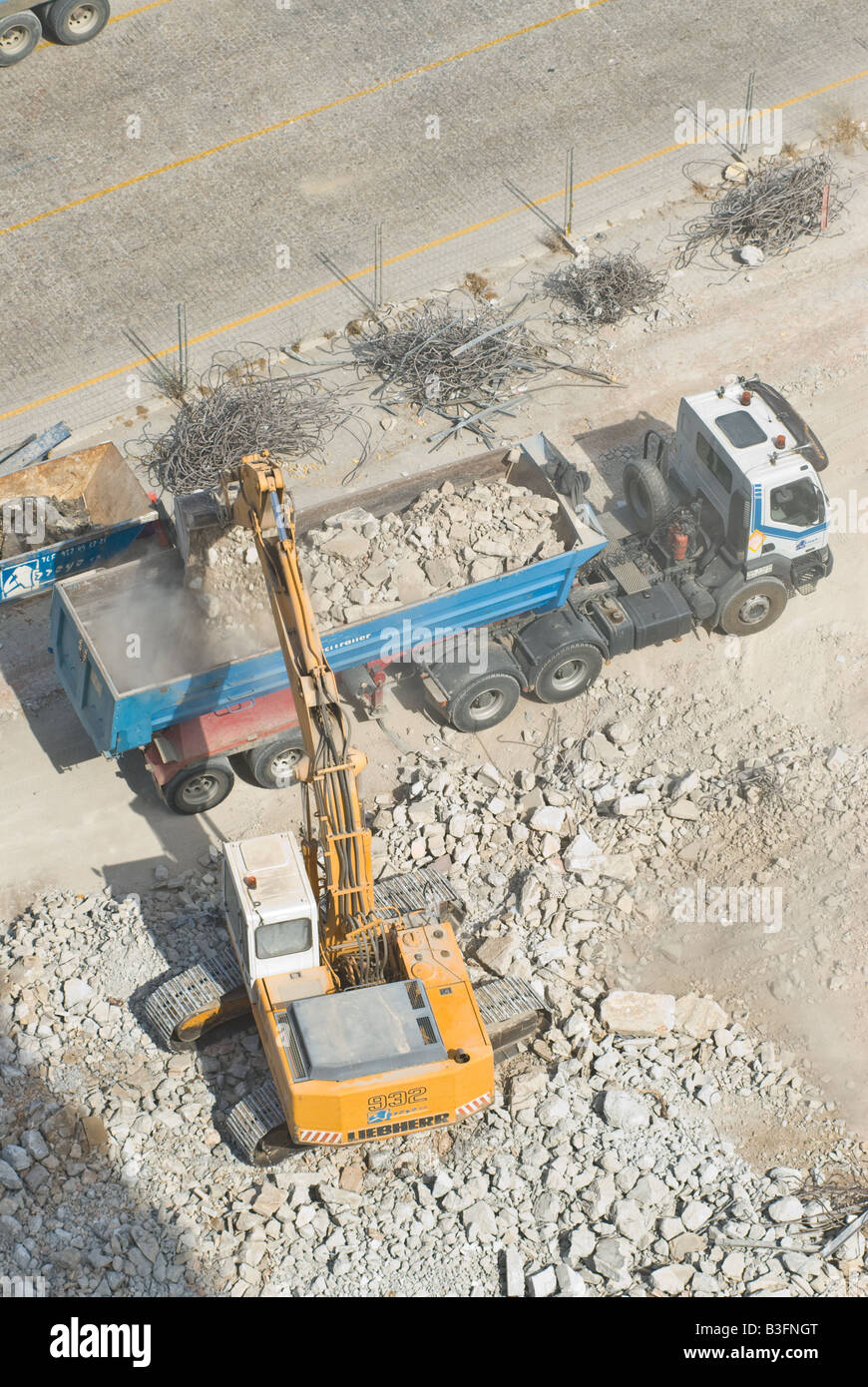 crawler bucket excavator loading semi-trailer truck Stock Photo - Alamy