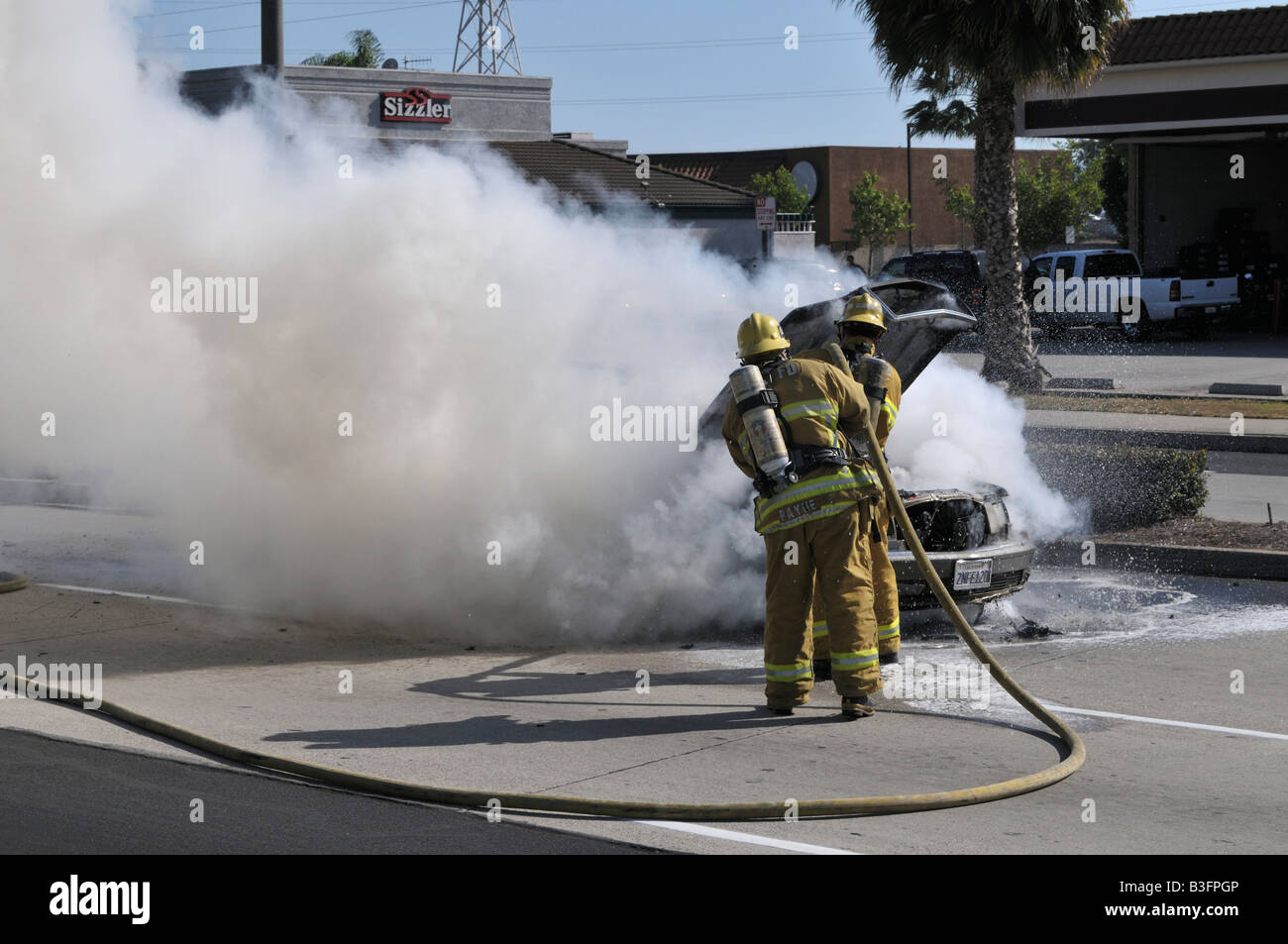 Putting out fire hi-res stock photography and images - Alamy