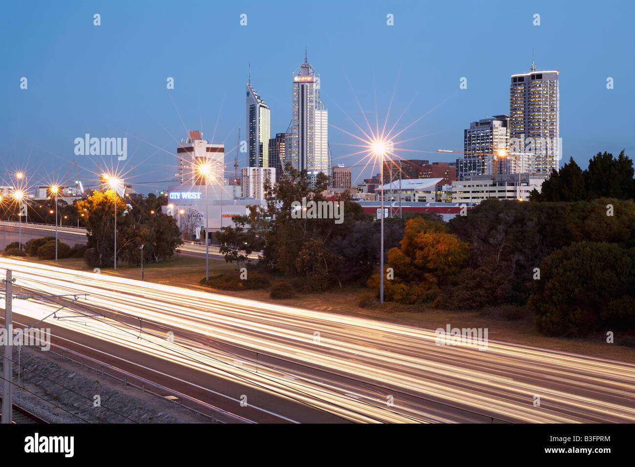 Light trails along the Mitchell Freeway heading north, with the city of ...