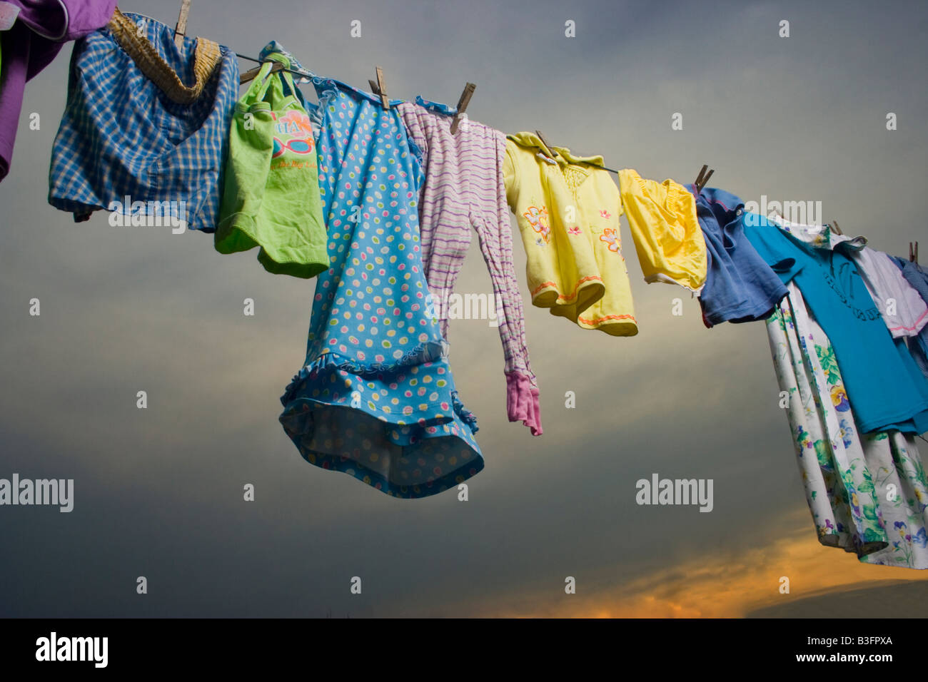 Hanging out clothes to dry on the line Stock Photo - Alamy