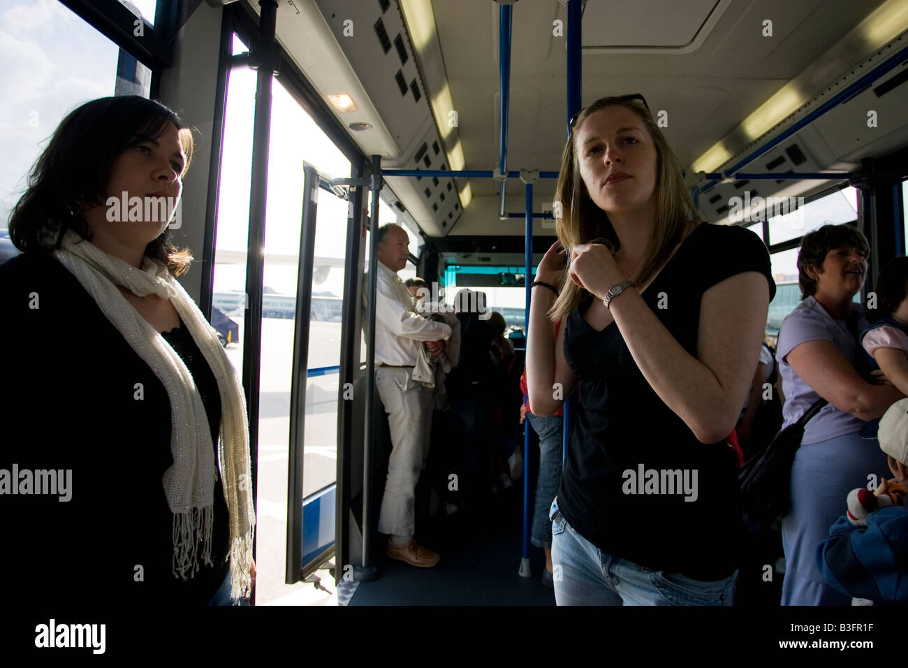 Inside airport bus being transferred to terminal from plane on arrival ...