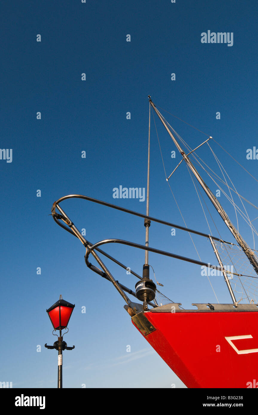 The front end of a Boat Yacht and red light at the entrance to Tenby ...