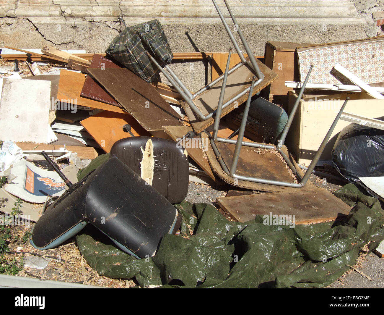 old chairs dumped outdoors in sun Stock Photo - Alamy