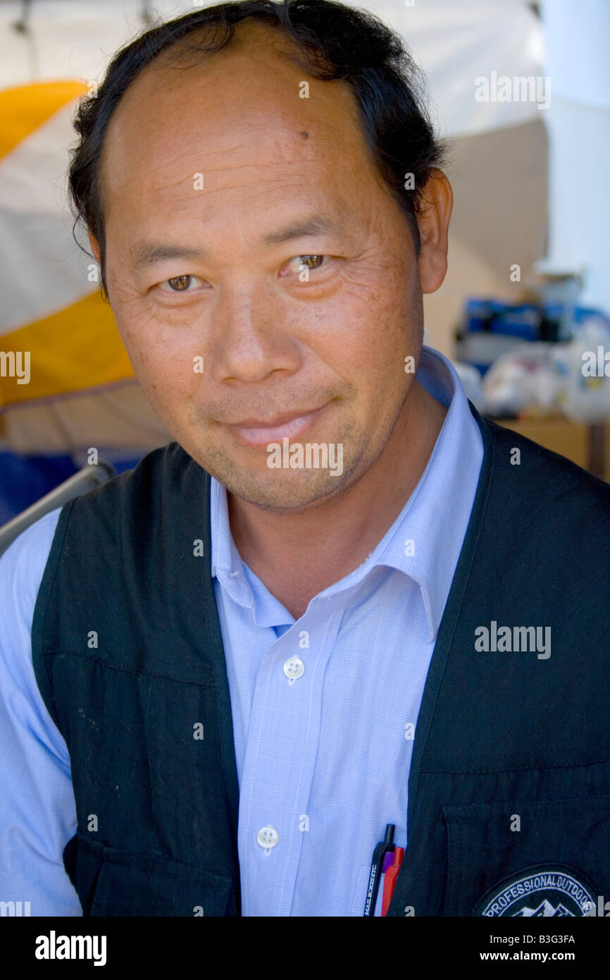 Kind Hmong shopkeeper working at his concession stand. Hmong Sports ...