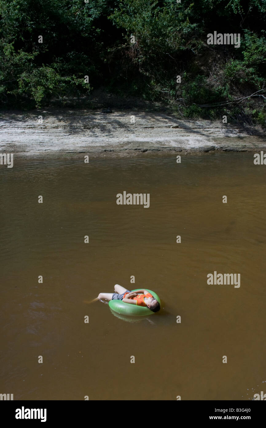 Floating down river innertube Stock Photo - Alamy