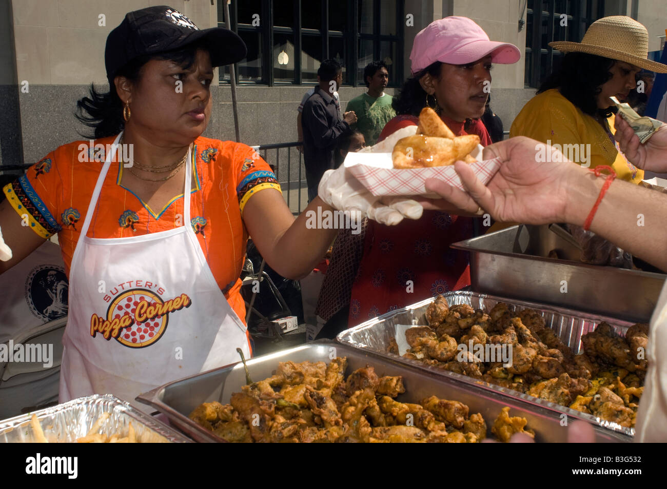 Parade goers are served authentic Indian food from vendors at the ...