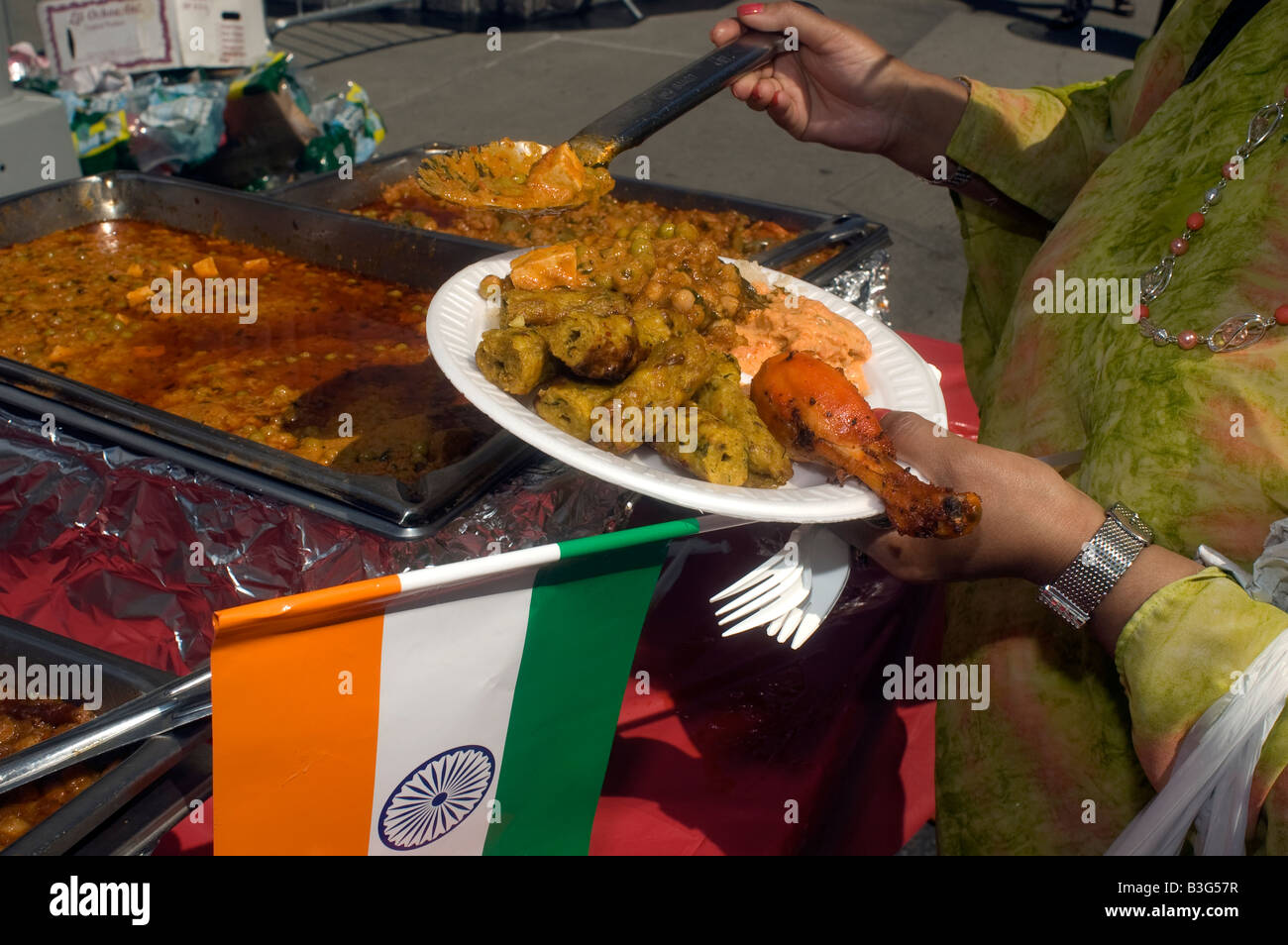 Paradegoers are served authentic Indian food from vendors at the street ...