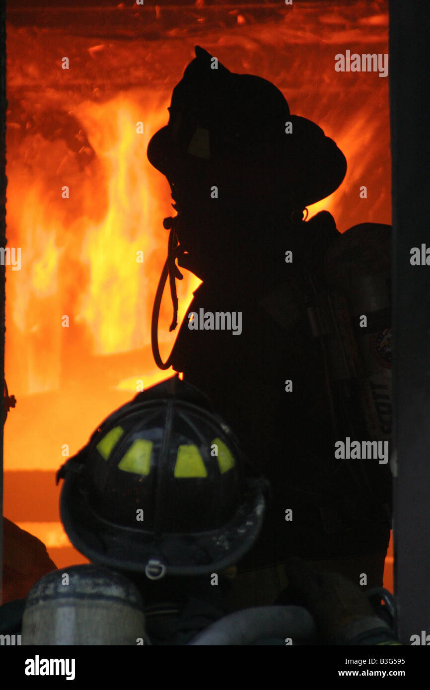 Firefighters putting out fire in hi-res stock photography and images ...