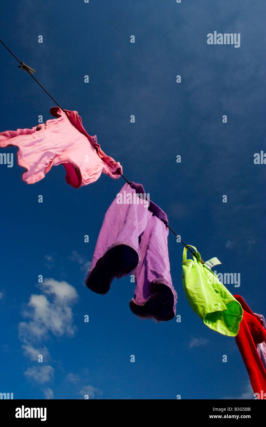 Hanging out clothes to dry on the line Stock Photo - Alamy