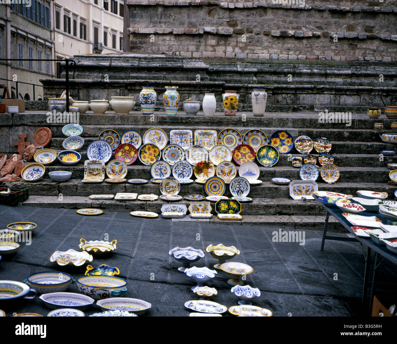 Local pottery market, with wares of traditional designs, on the steps ...