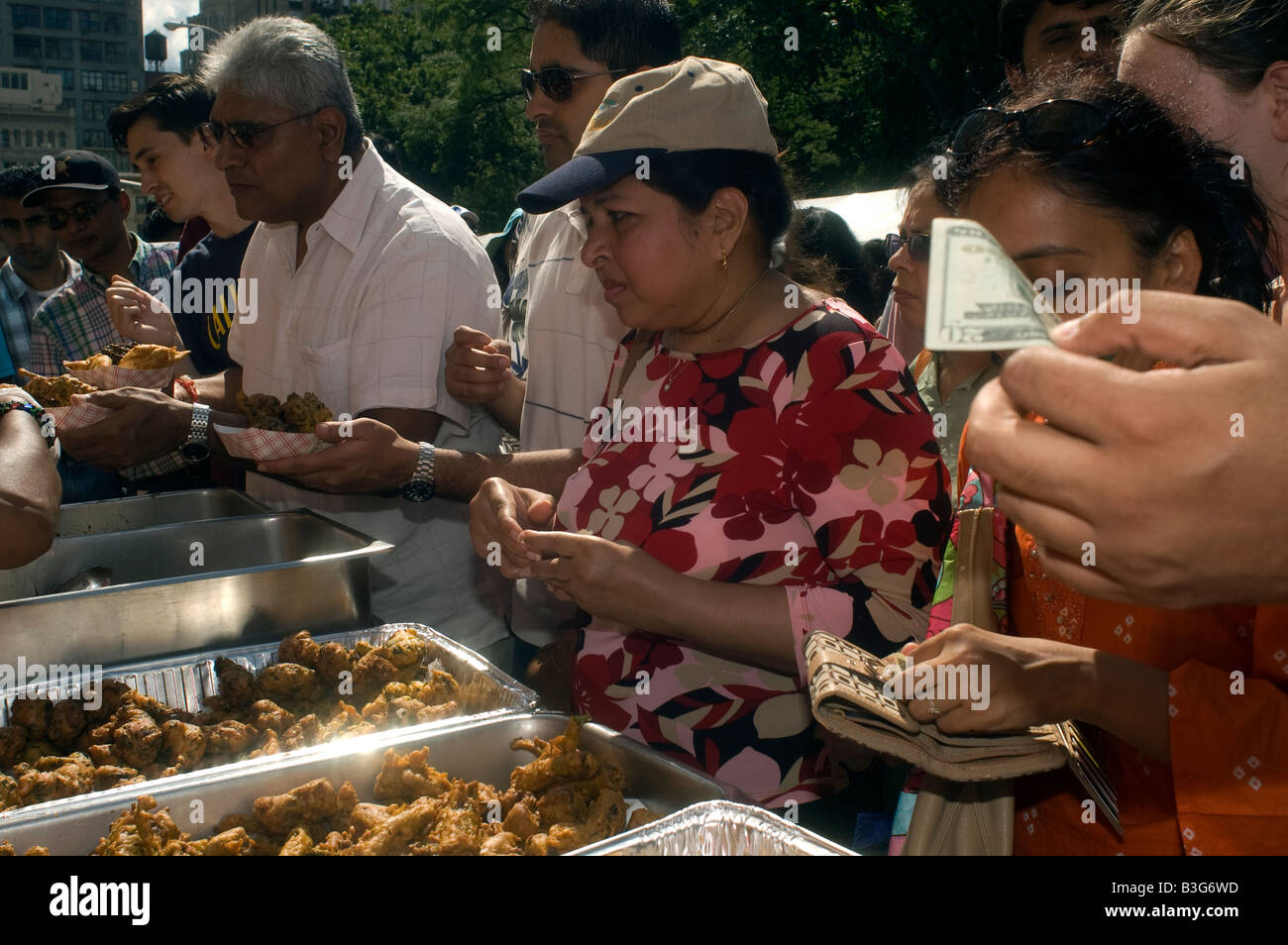 Paradegoers are served authentic Indian food from vendors at the street ...