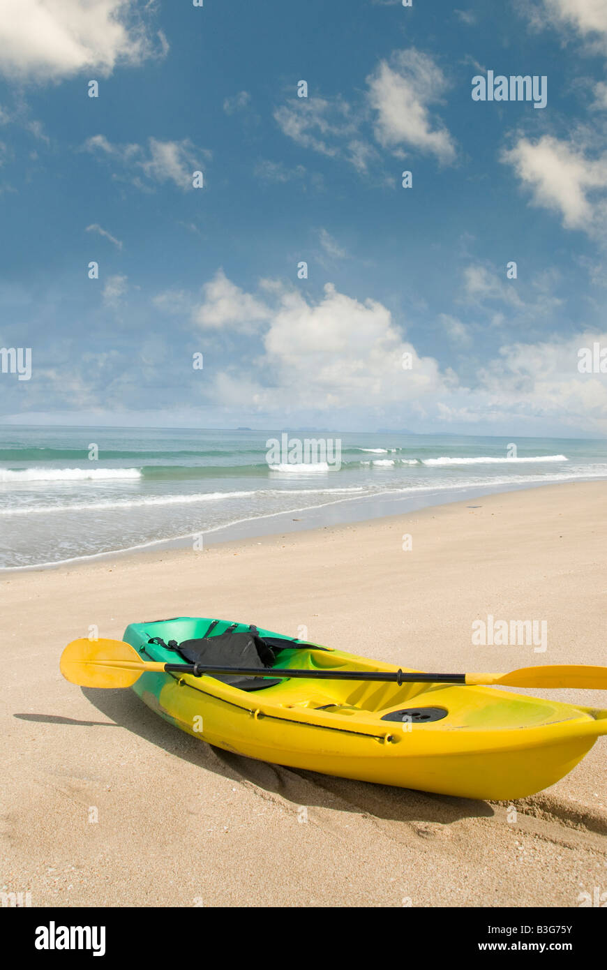 Ocean kayak on the beach with blue sky Stock Photo - Alamy