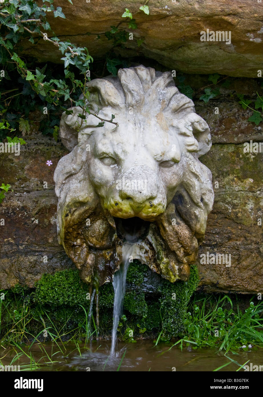 Lion headed roadside spring Stock Photo - Alamy