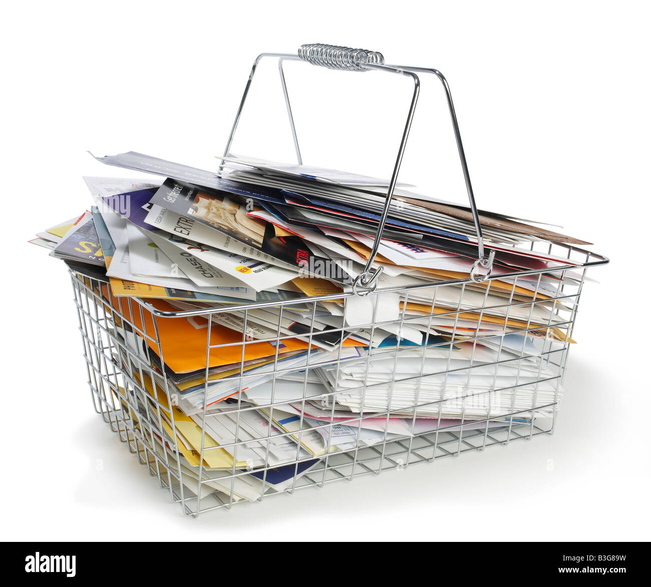 Shopping basket with junk mail Stock Photo - Alamy