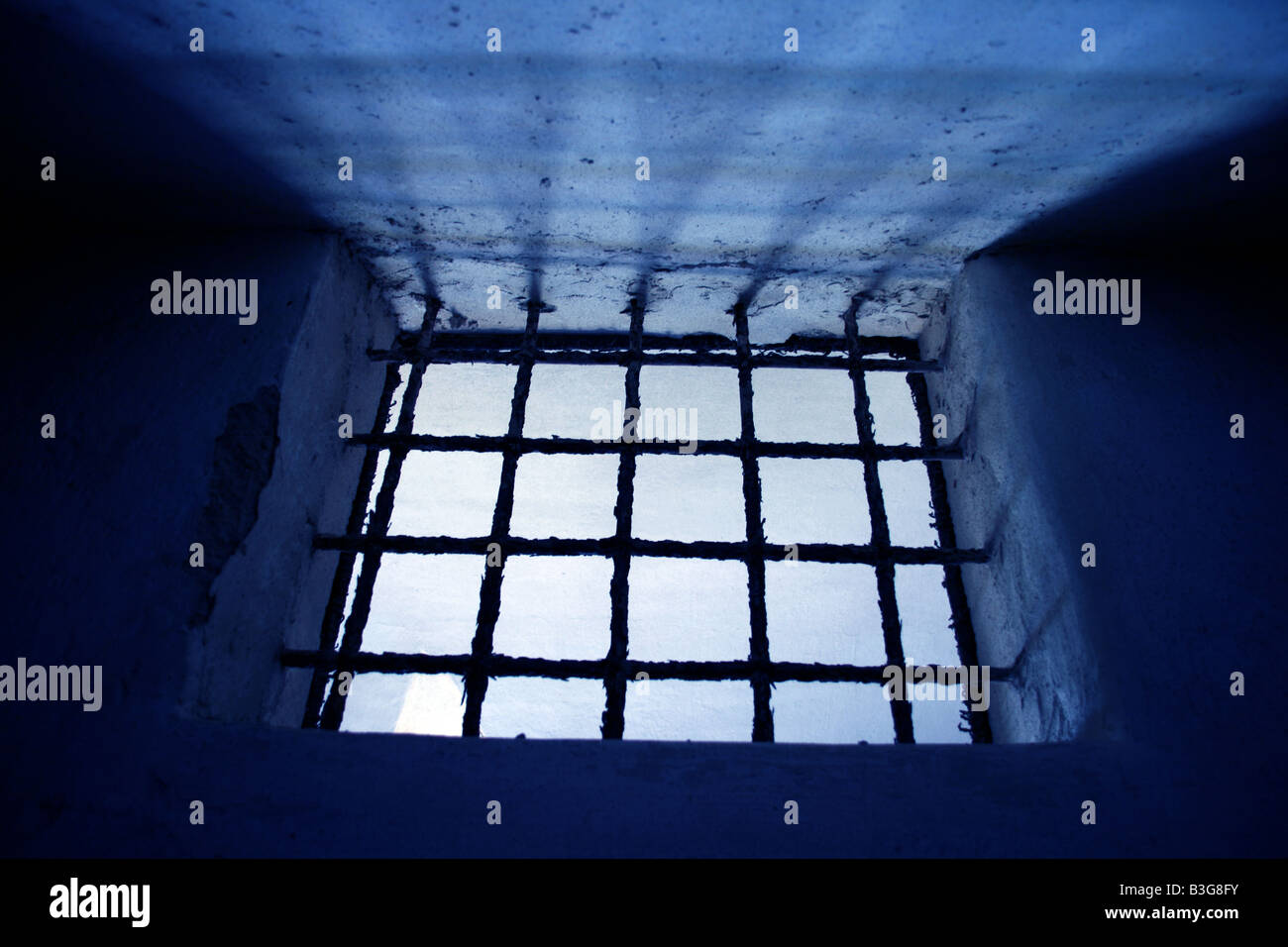 one high dark prison cell window with metal bars Stock Photo - Alamy