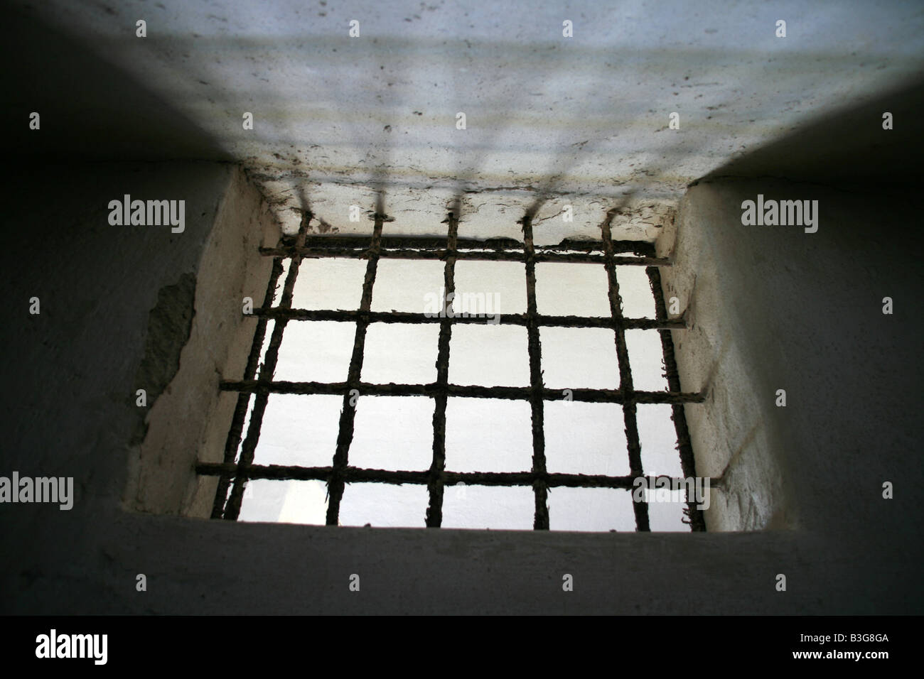 one high dark prison cell window with metal bars Stock Photo - Alamy