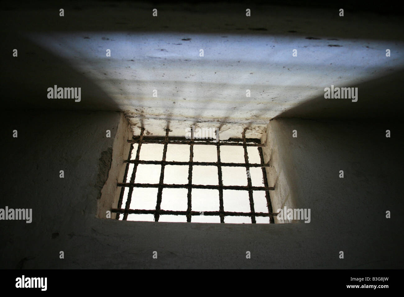one high dark prison cell window with metal bars Stock Photo - Alamy