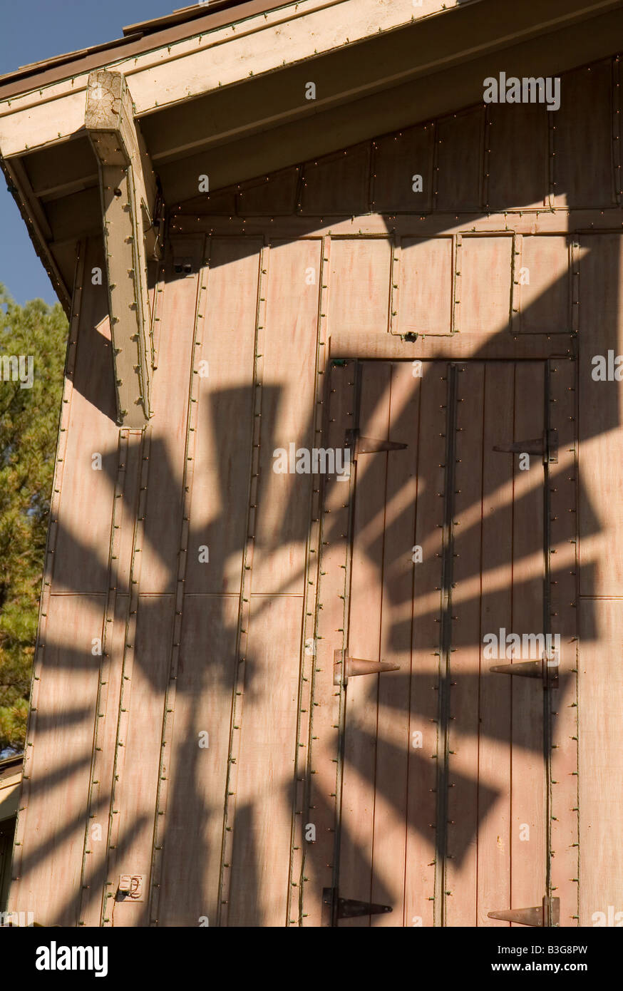 The shadow of a windmill on an old barn Stock Photo - Alamy