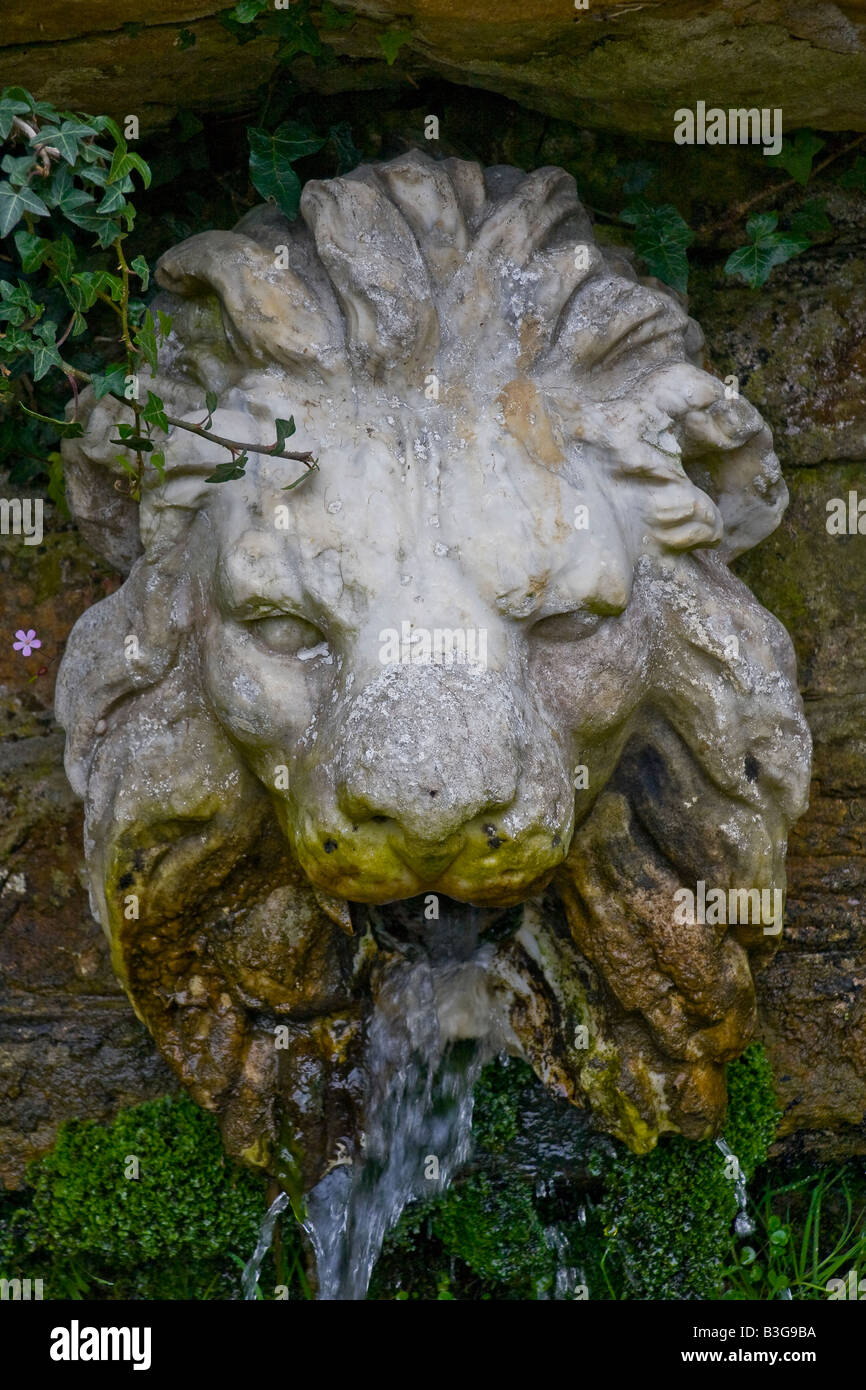 Old Lion headed water spring Stock Photo - Alamy