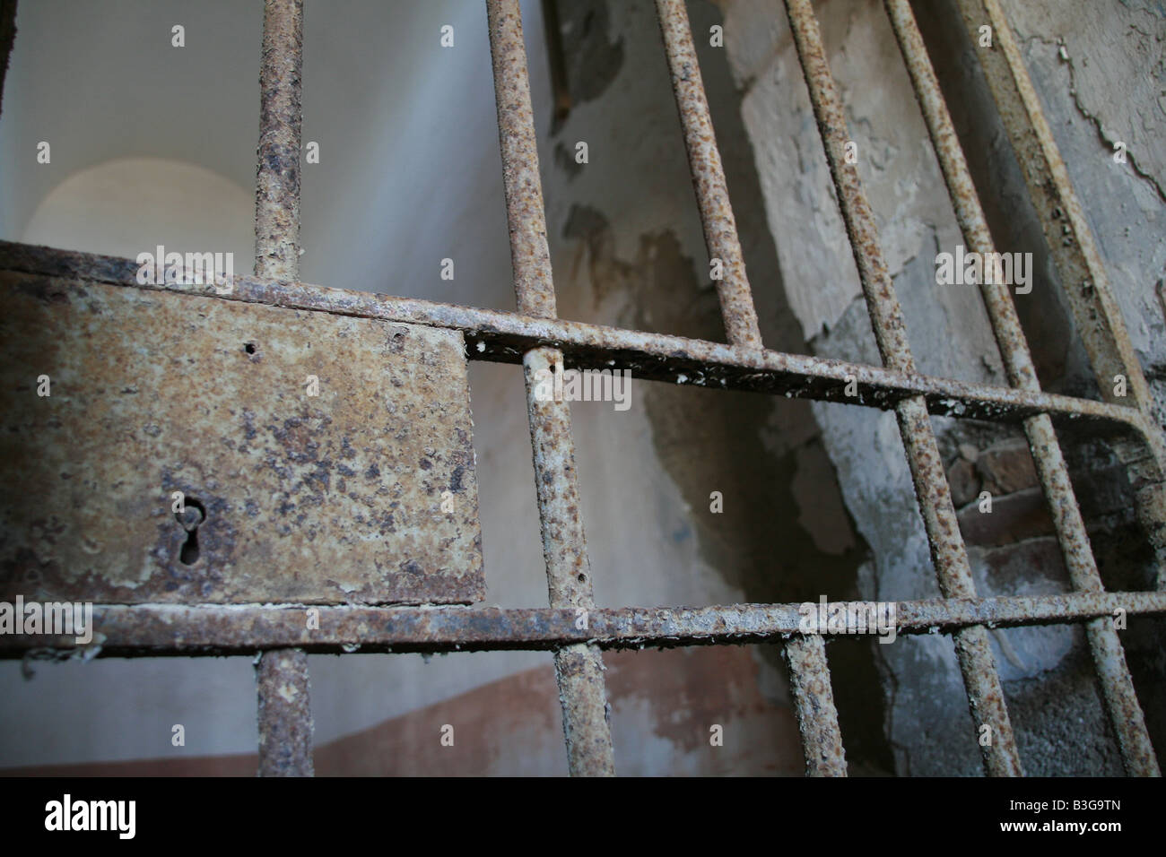one old moody dark derelict empty prison cell Stock Photo - Alamy