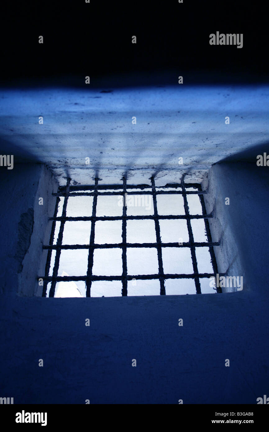 one high dark prison cell window with metal bars Stock Photo - Alamy