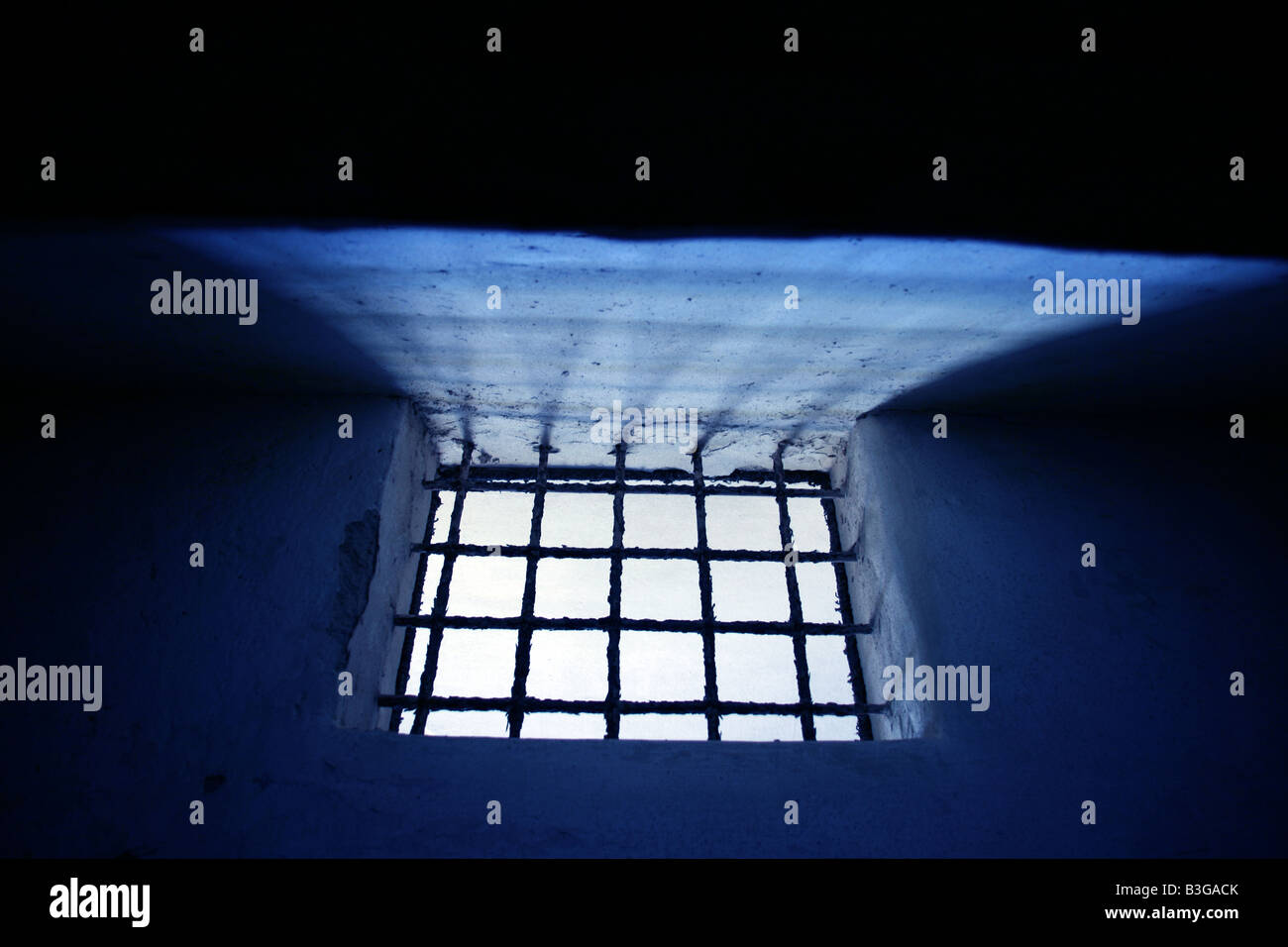 one high dark prison cell window with metal bars Stock Photo - Alamy