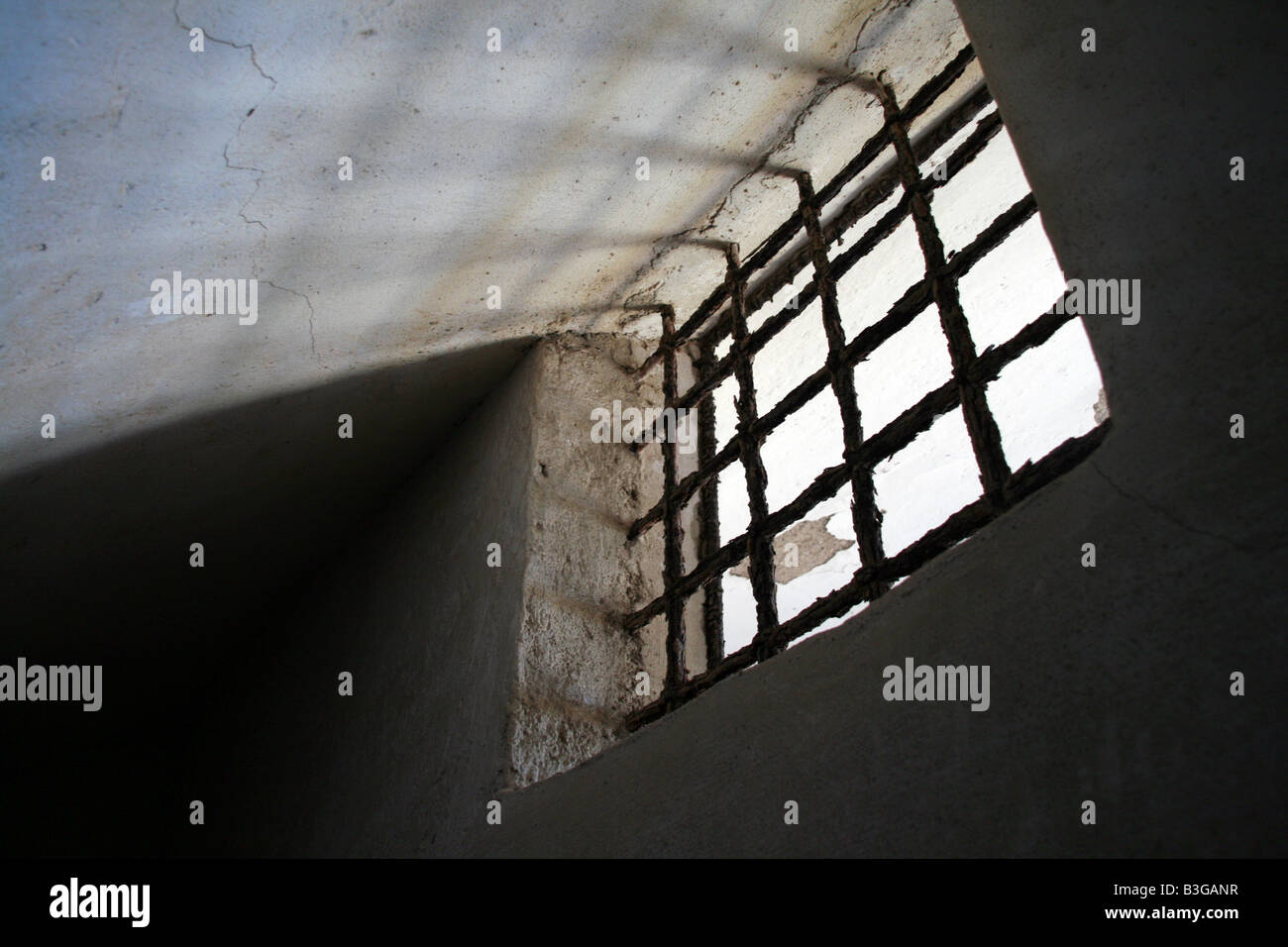 one high dark prison cell window with metal bars Stock Photo - Alamy