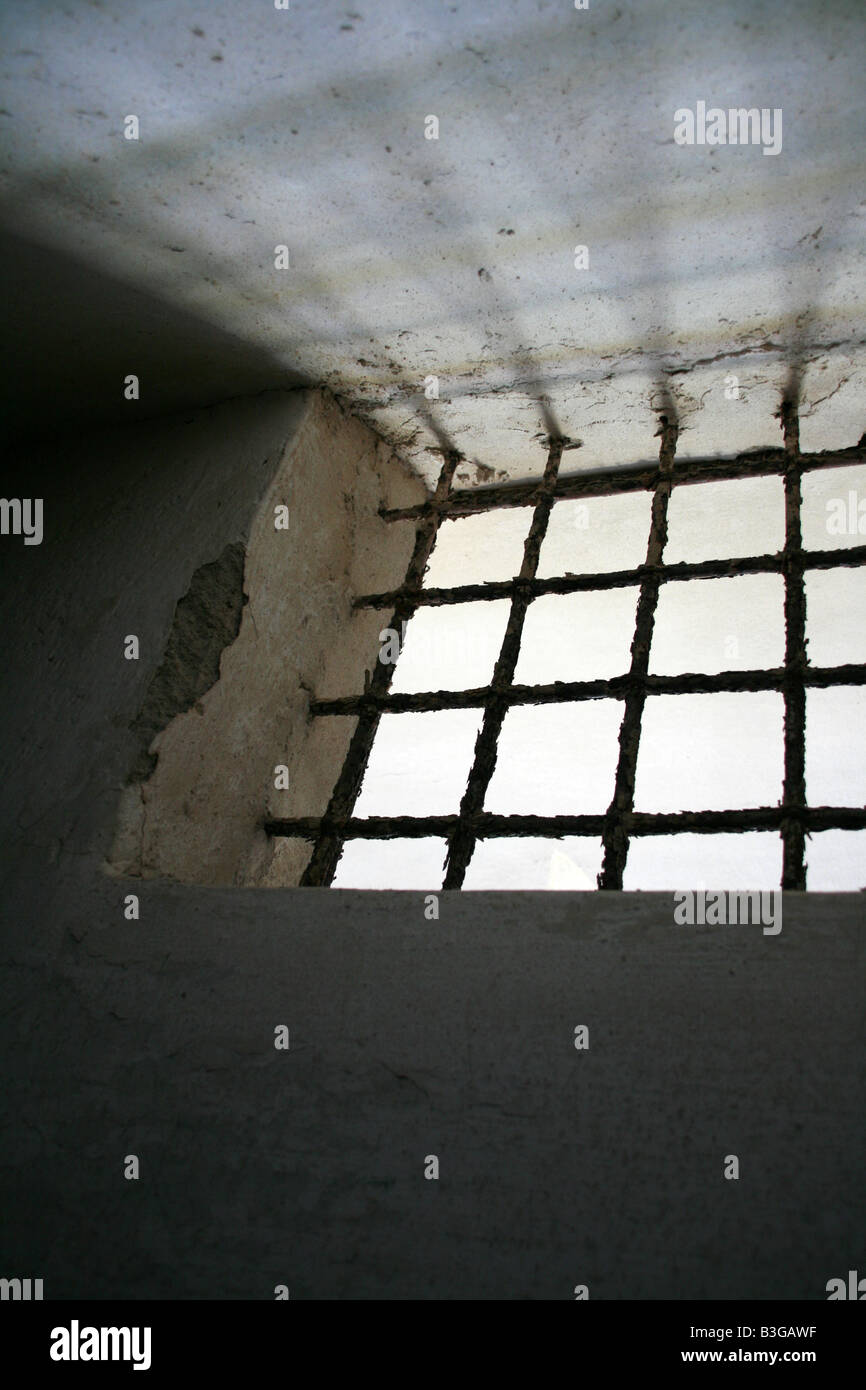 one high dark prison cell window with metal bars Stock Photo - Alamy
