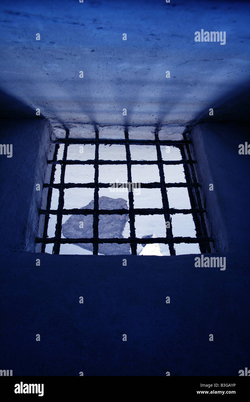 one high dark prison cell window with metal bars Stock Photo - Alamy