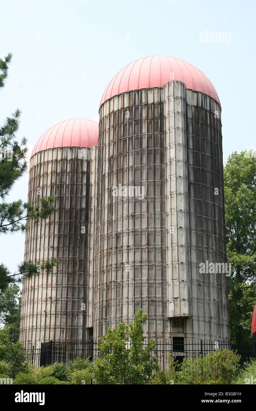 Two grain silos rising into the sky Stock Photo - Alamy