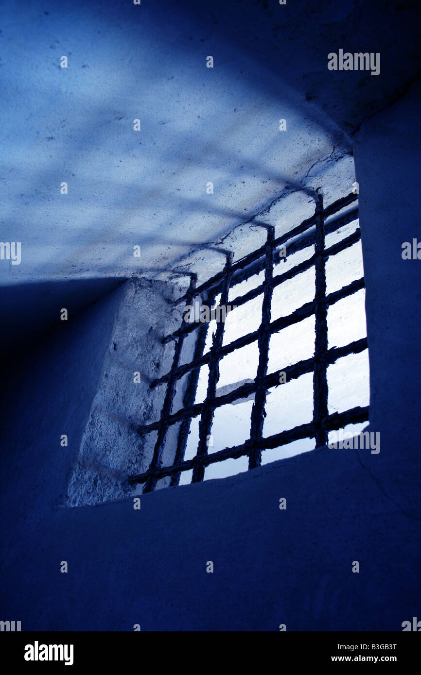 one high dark prison cell window with metal bars Stock Photo - Alamy