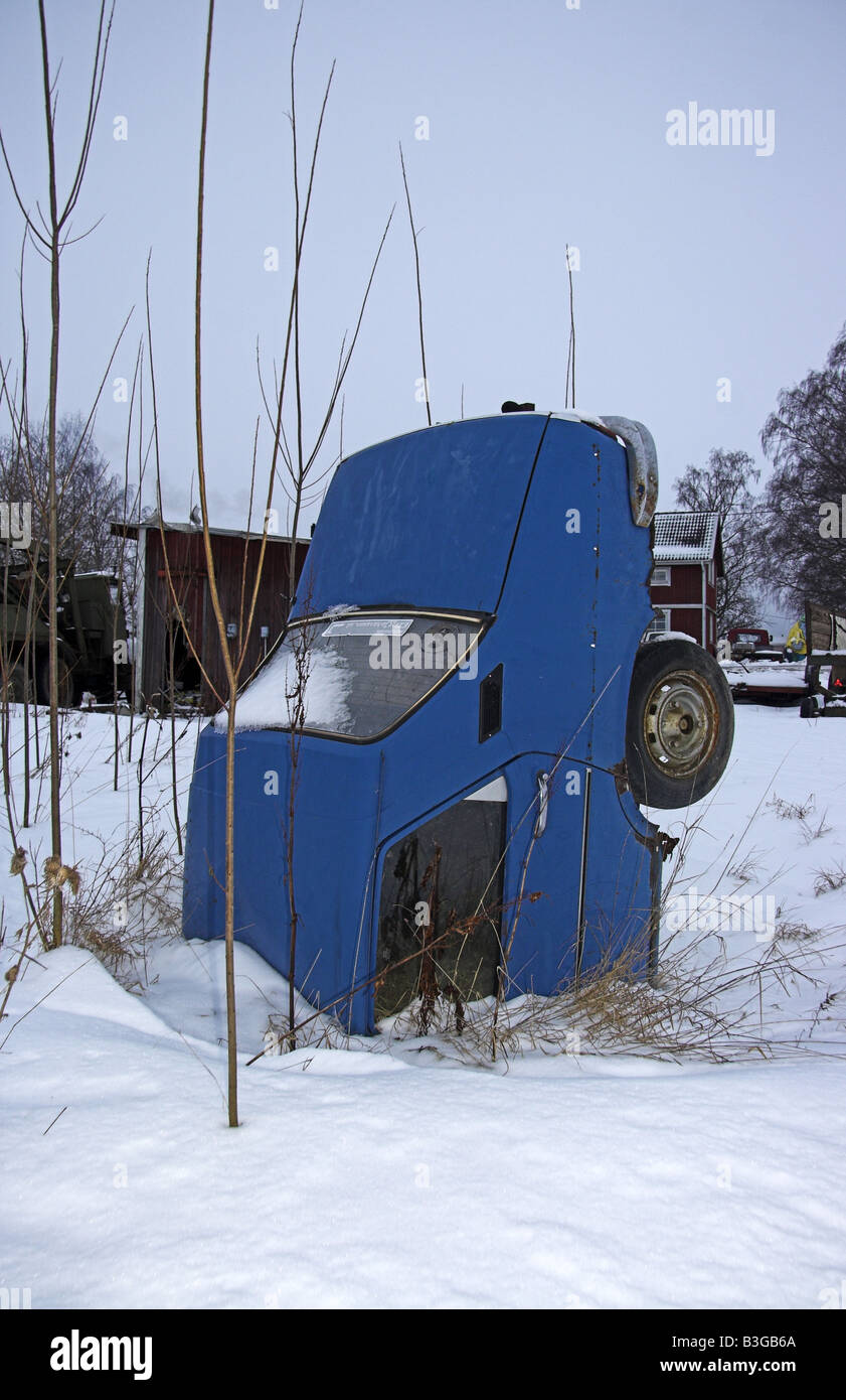Wrecked blue Saab on its nose in the snow Stock Photo - Alamy