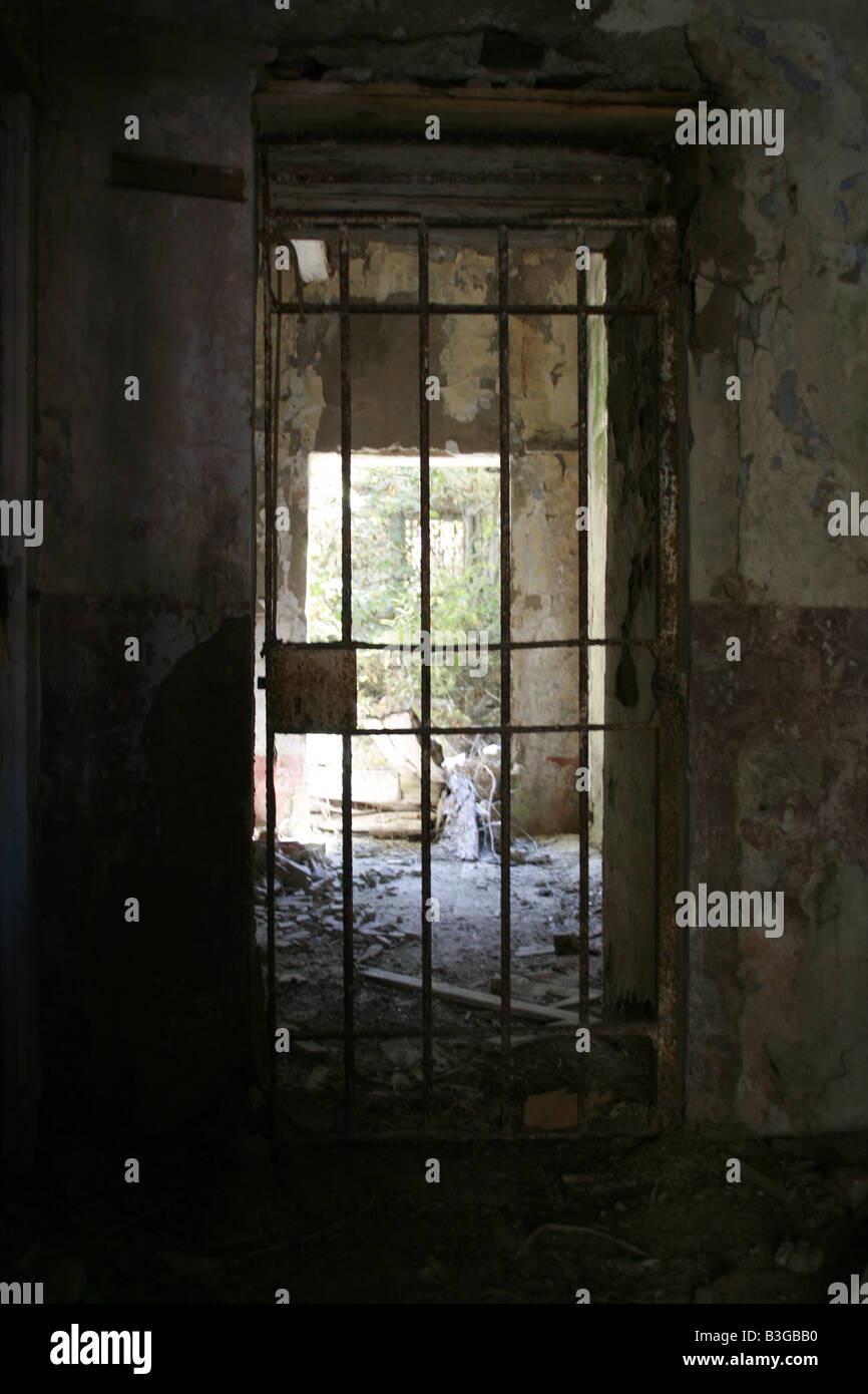 one old moody dark derelict empty prison cell Stock Photo - Alamy