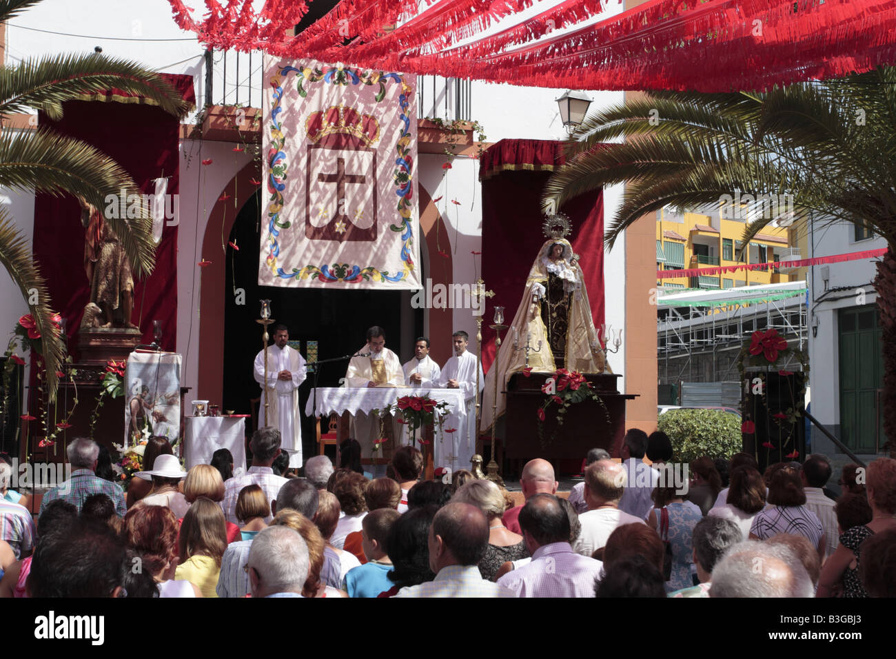 A Catholic mass service outside the church to celebrate the Fiesta of ...