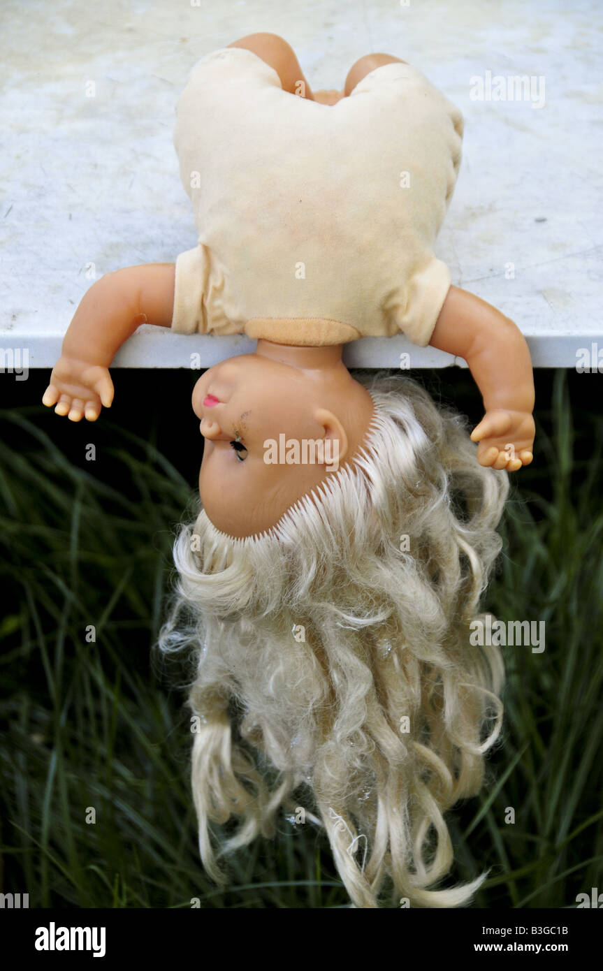 long hair blonde doll falling down Stock Photo - Alamy