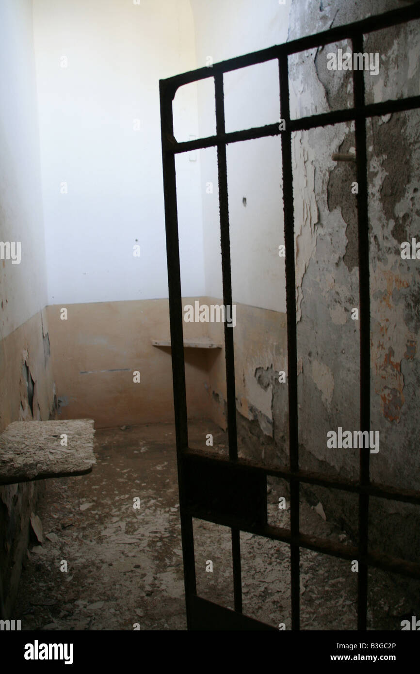 one old moody dark derelict empty prison cell Stock Photo - Alamy