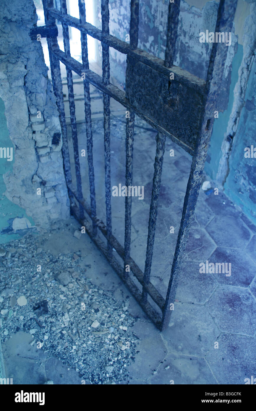 one old moody dark derelict empty prison cell Stock Photo - Alamy