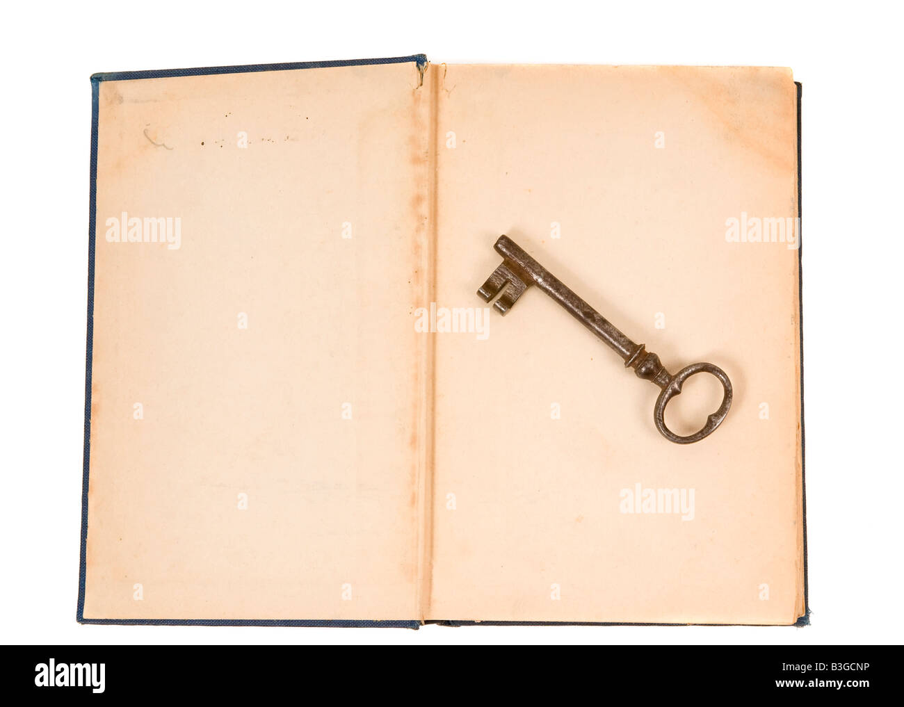 An old key sits on top of an old book unlocking the past Stock Photo ...