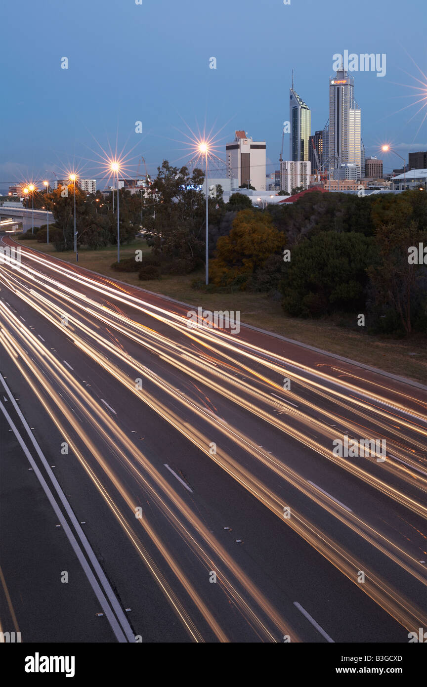 Light trails along the Mitchell Freeway heading north, with the city of ...