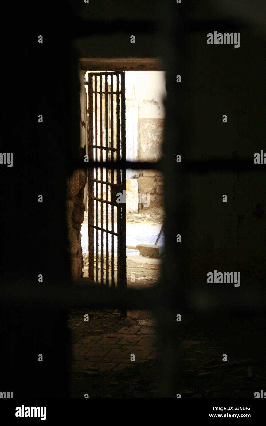 one old moody dark derelict empty prison cell Stock Photo - Alamy